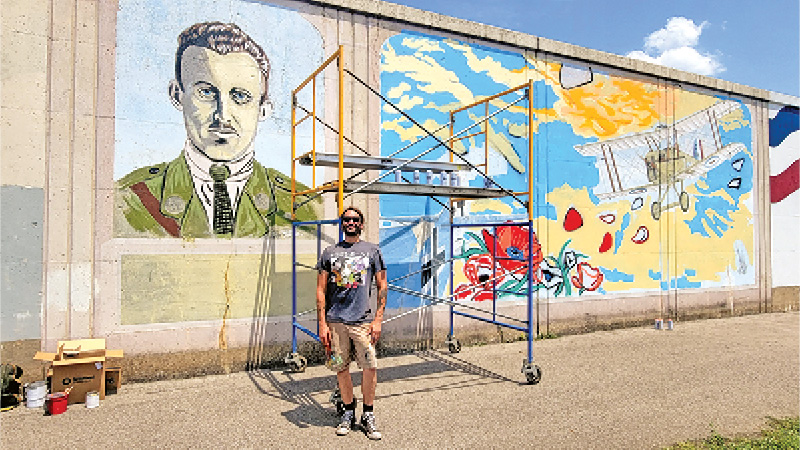 Flying high again: Col. Lambert mural being repainted by Ironton artist ...